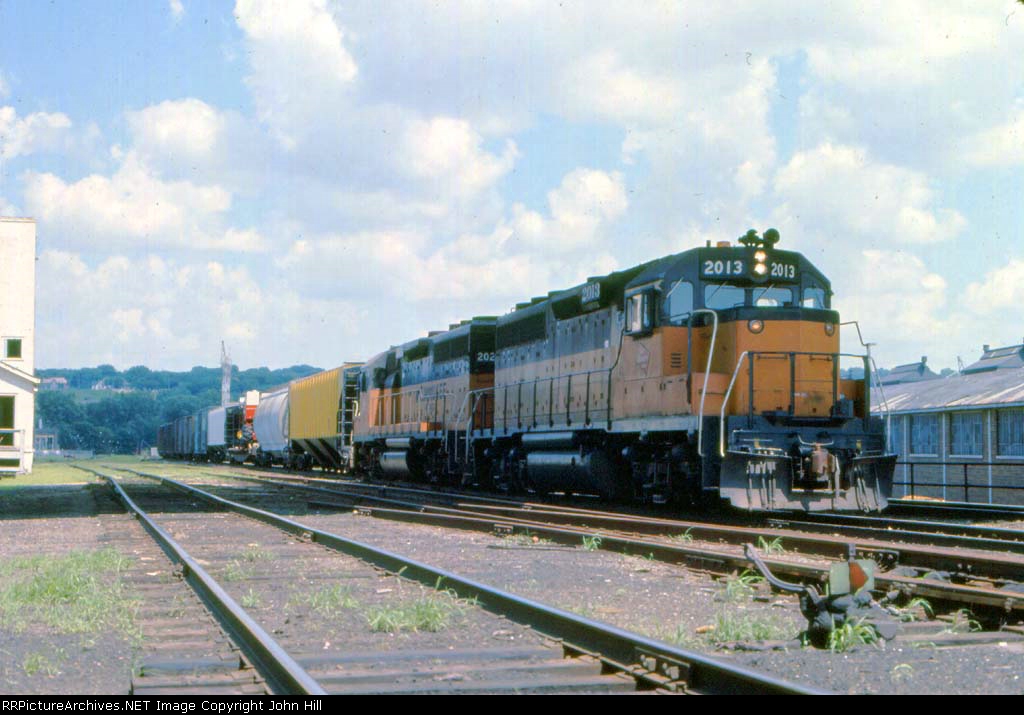 1001-33 Westbound MILW freight passes St. Paul Union Depot (SPUD)